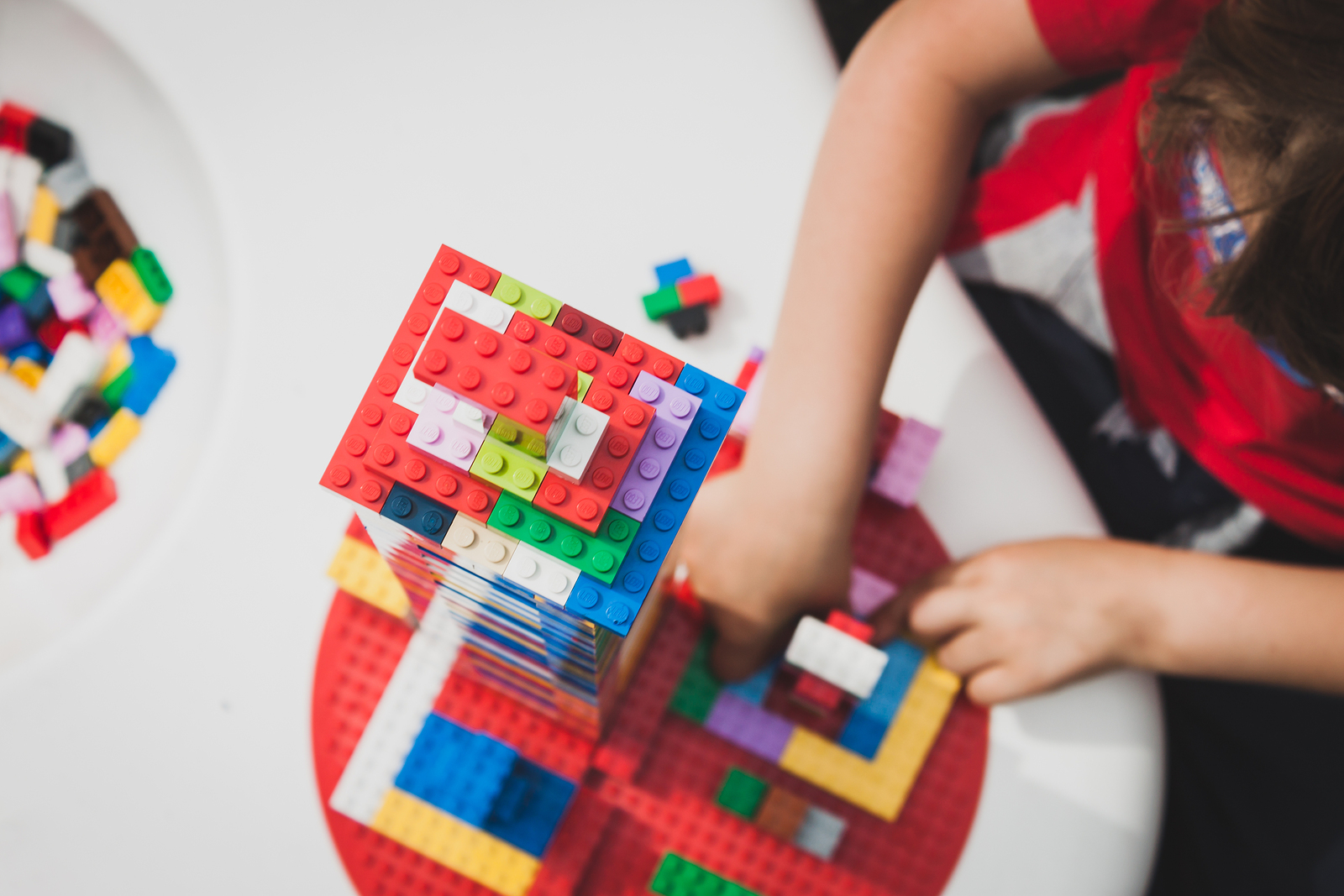 Child Plays with Lego for Fine Motor Skill Development • Sensation Station